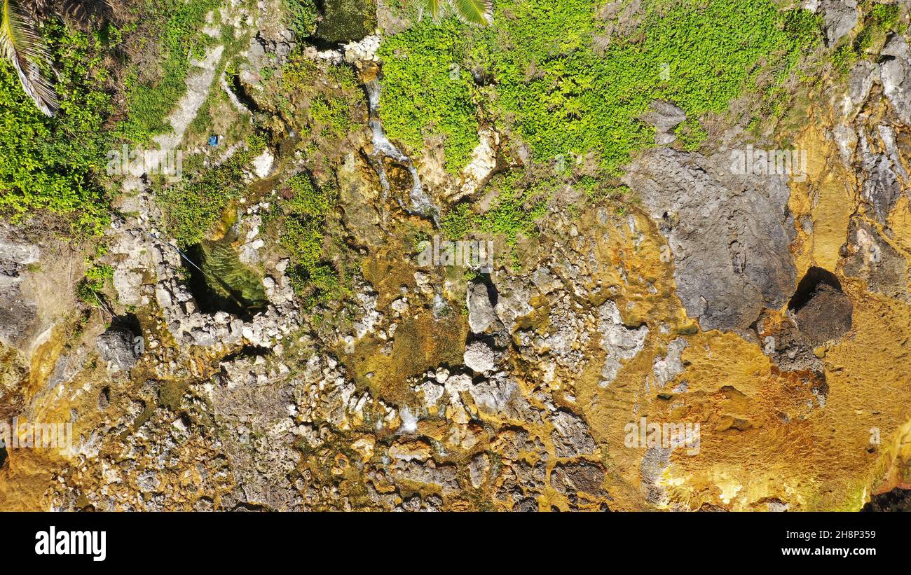 Aerial moving down to Seganing Waterfall, Nusa Penida, Bali, Indonesia ...