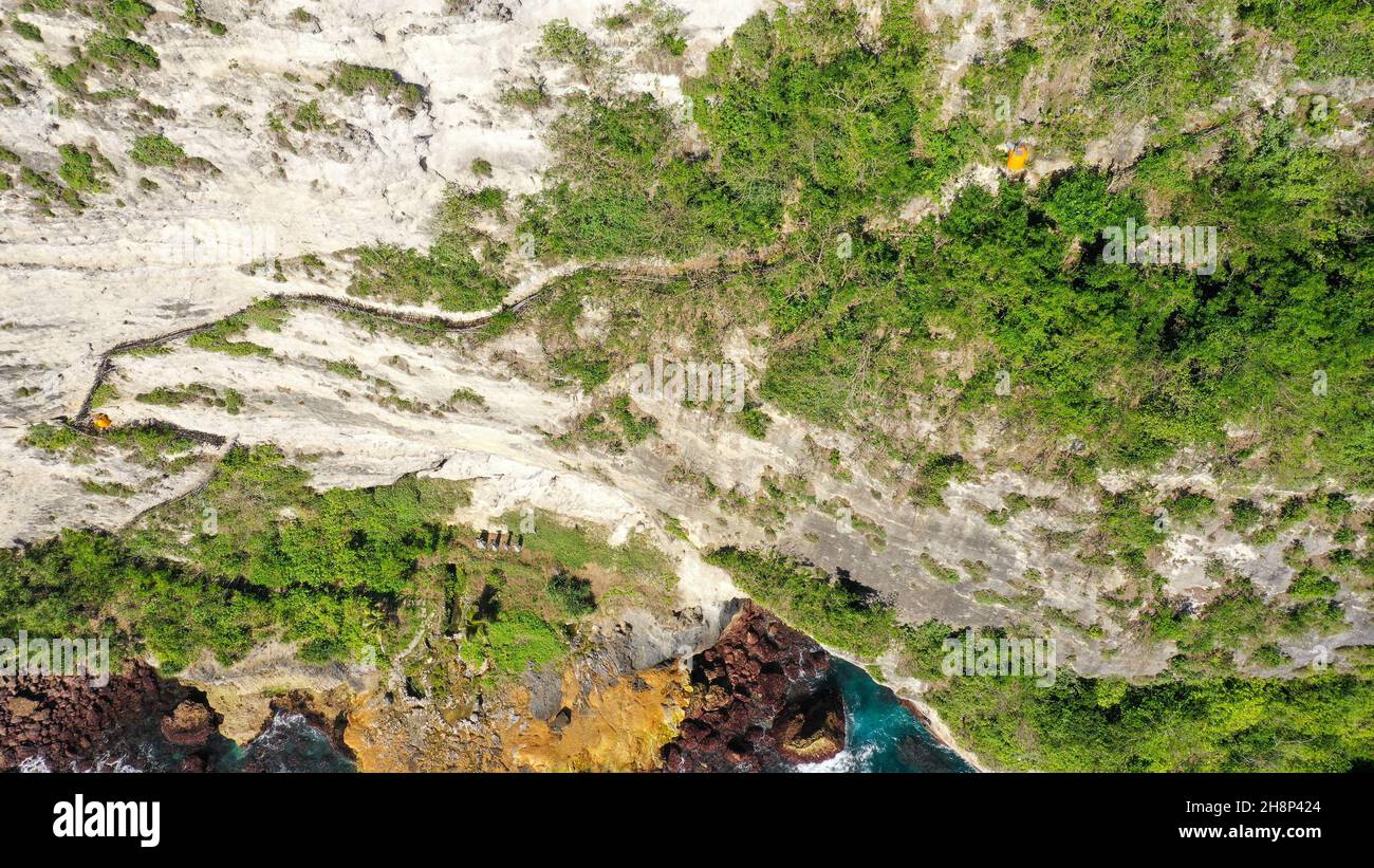 Extremely dangerous footpath on a cliff wall to Seganing Waterfall ...