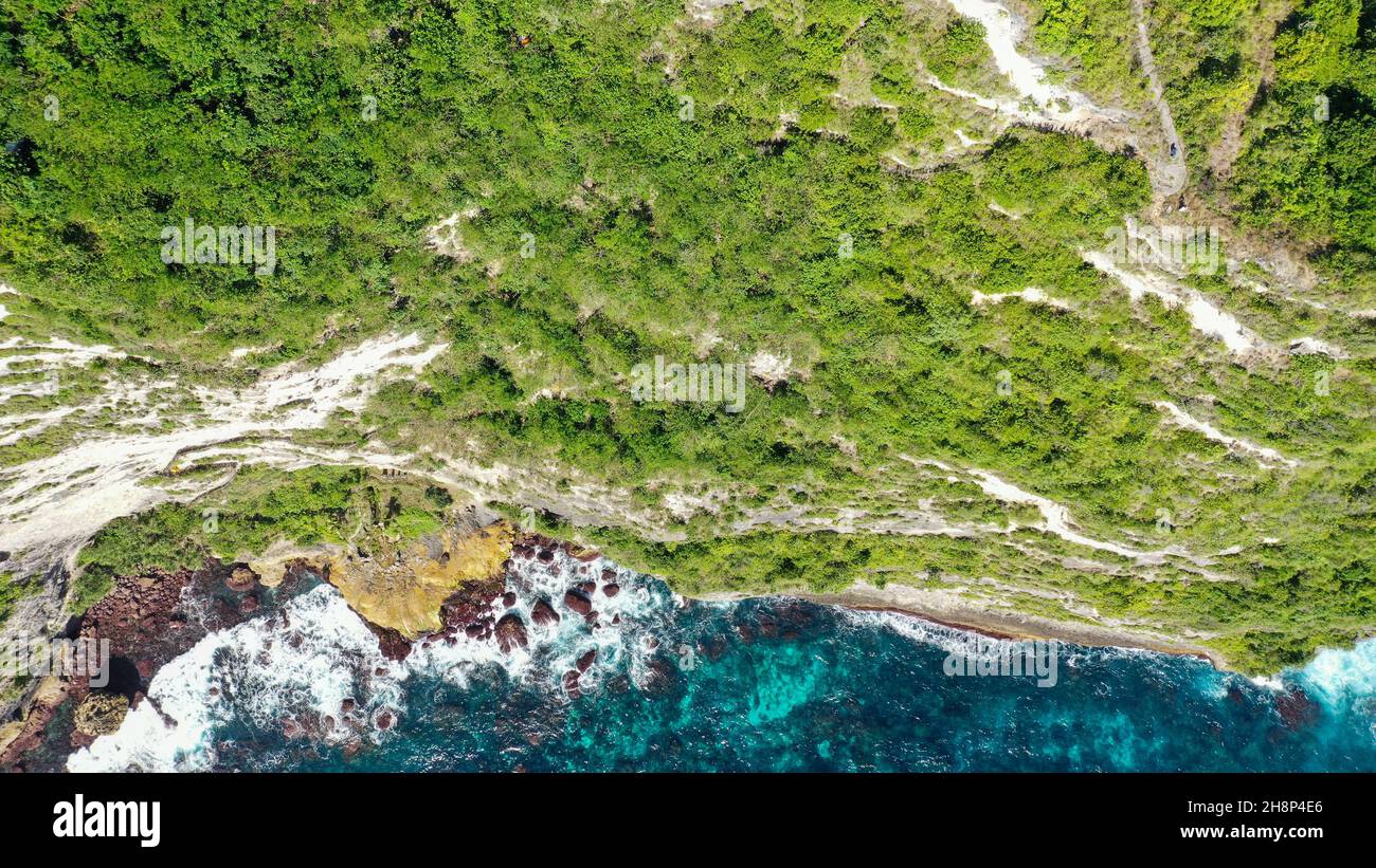 Extremely dangerous footpath on a cliff wall to Seganing Waterfall ...