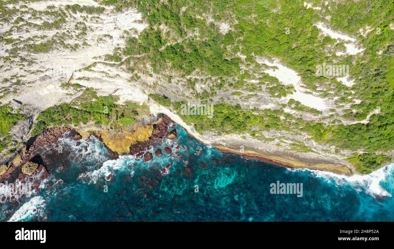Dangerous wooden walkway hanging alongside a vertical cliff. Extremely ...
