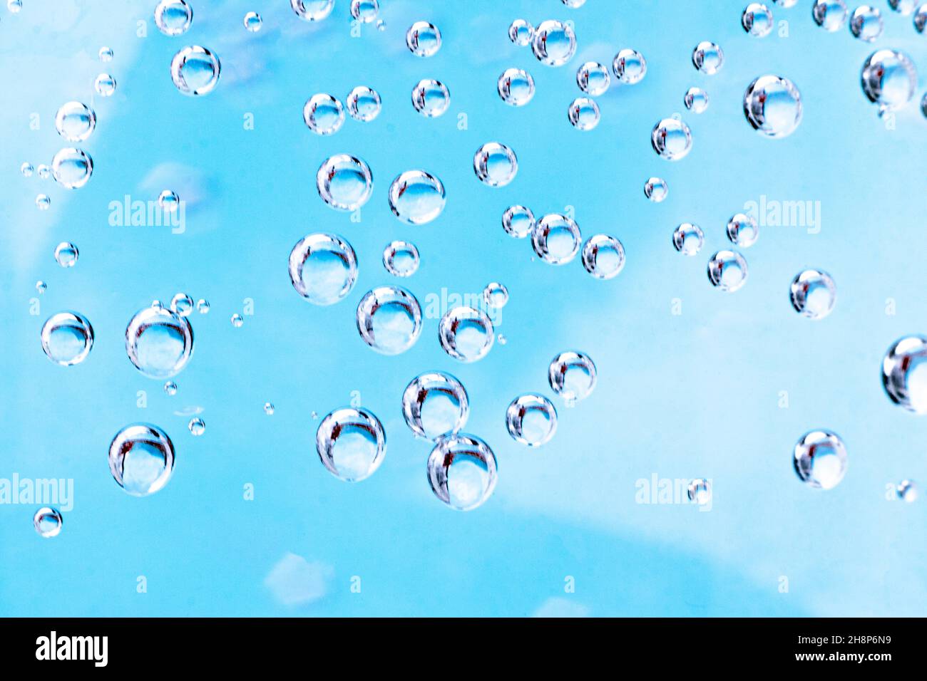 Liquid with bubbles. Abstract background with various size bubble in ...