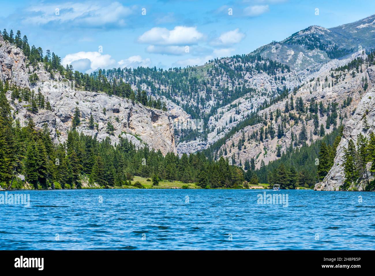 A large refreshing flow of water with a peaceful view of the Holter ...