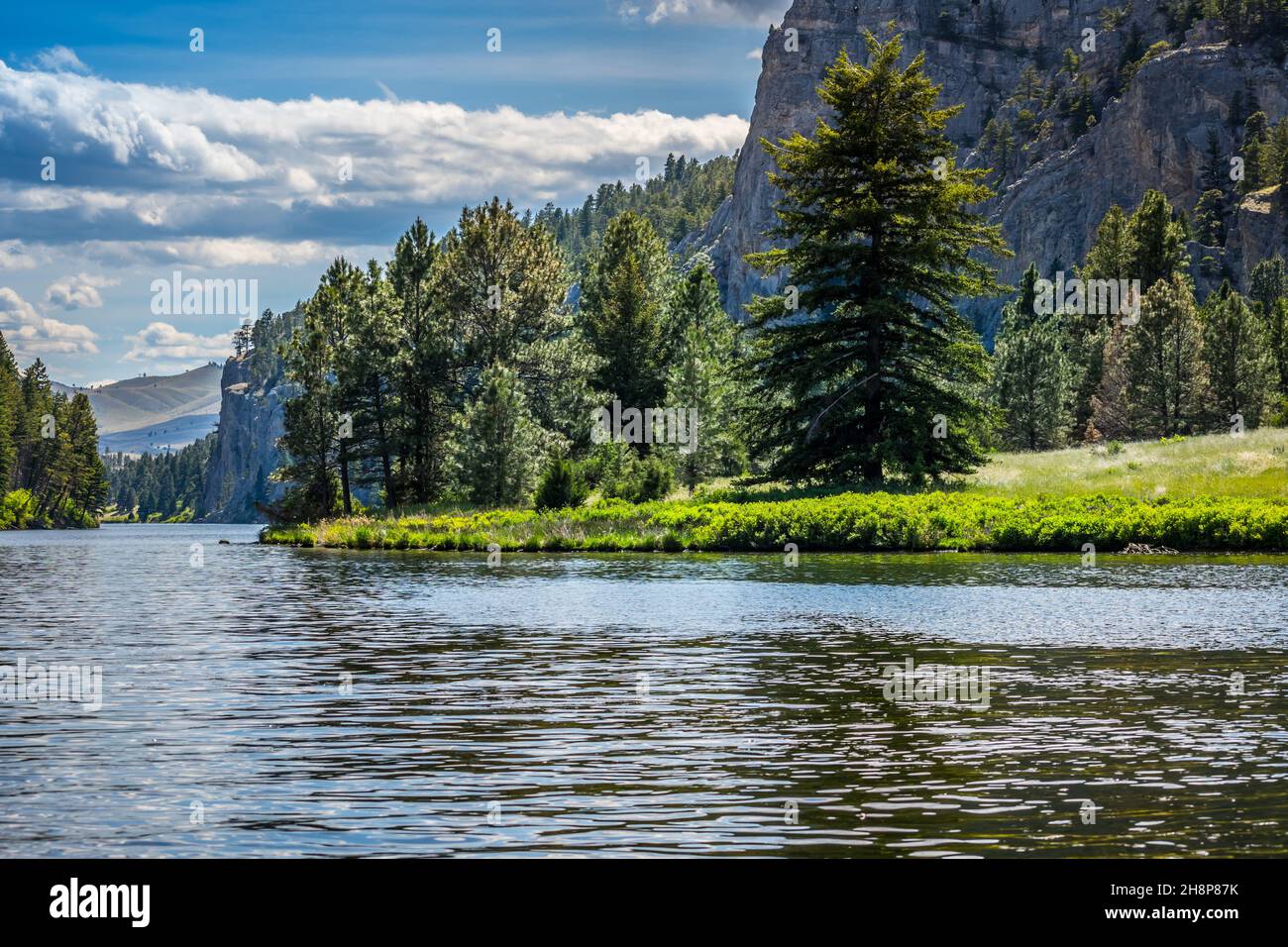 A large refreshing flow of water with a peaceful view of the Holter ...