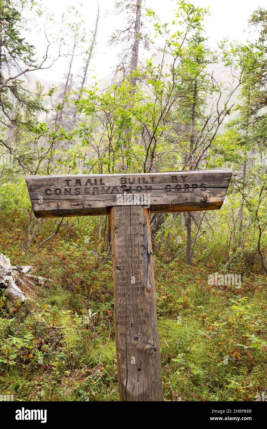 Sign for a hiking trail in the Yukon, Canada. The trail was built by ...