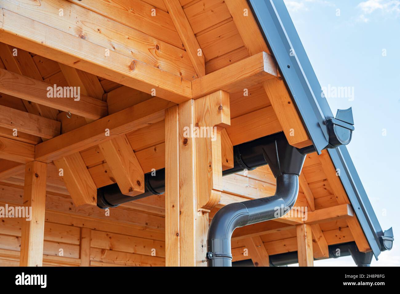 Wooden housing construction. The roof of a timber frame house. Frame ...