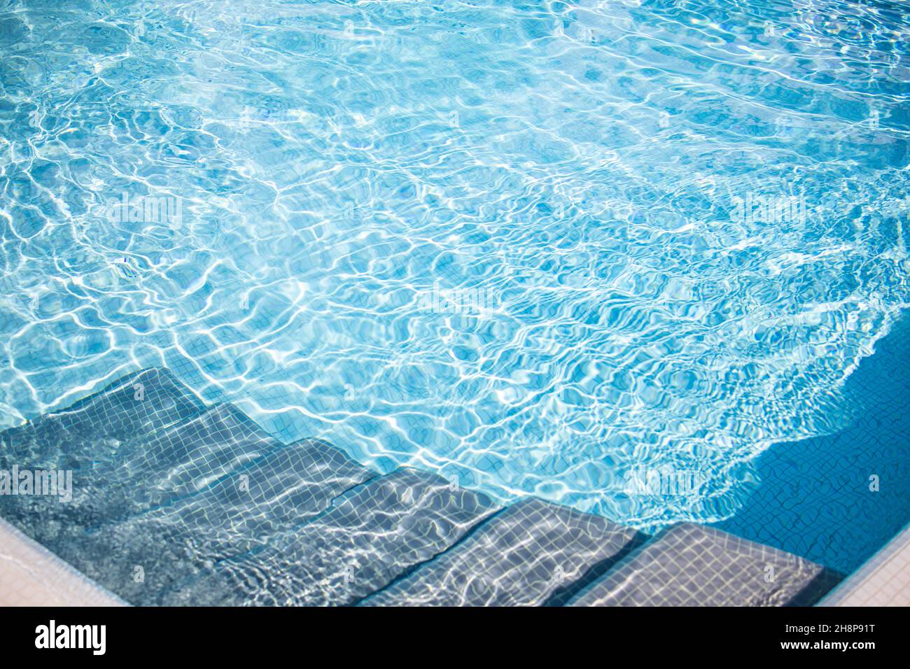 Edge of blue swimming pool. Summer water sport, recreational background ...