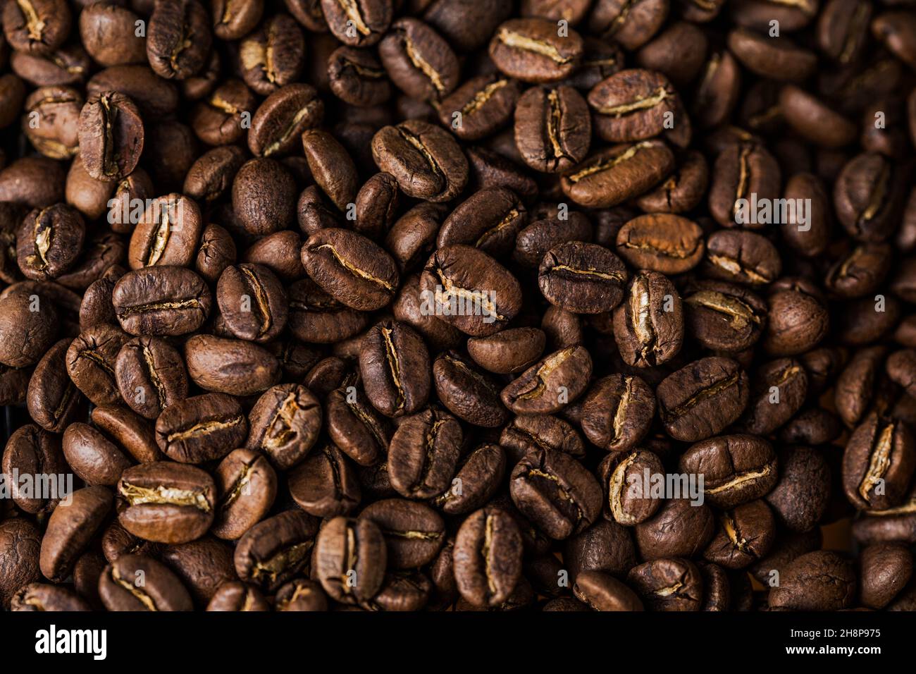 Coffee beans texture or coffee background. Fragrant fried bean a-smoke ...