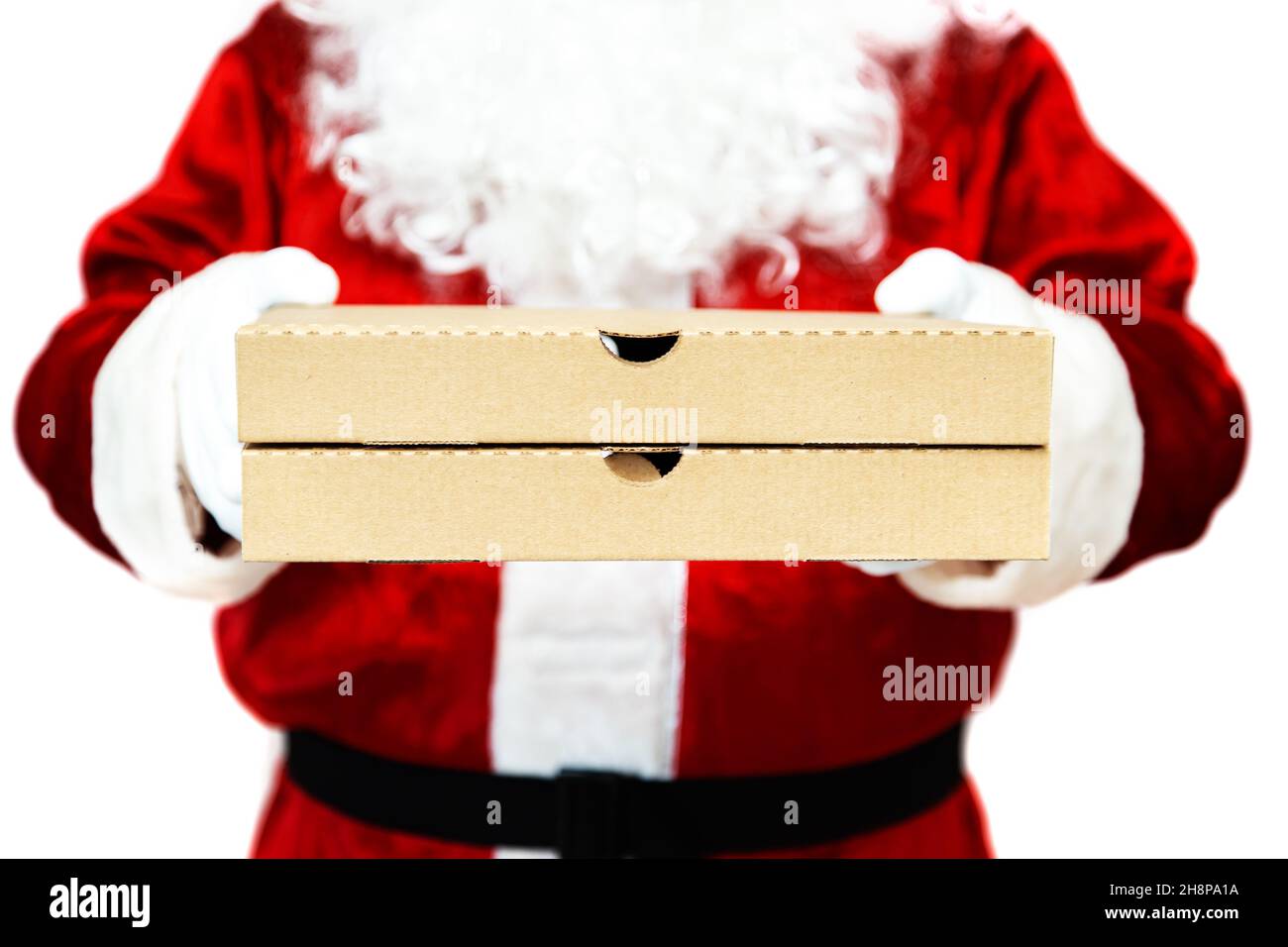 Pizza boxes in the hands of Santa Claus. Isolated on white. Christmas ...