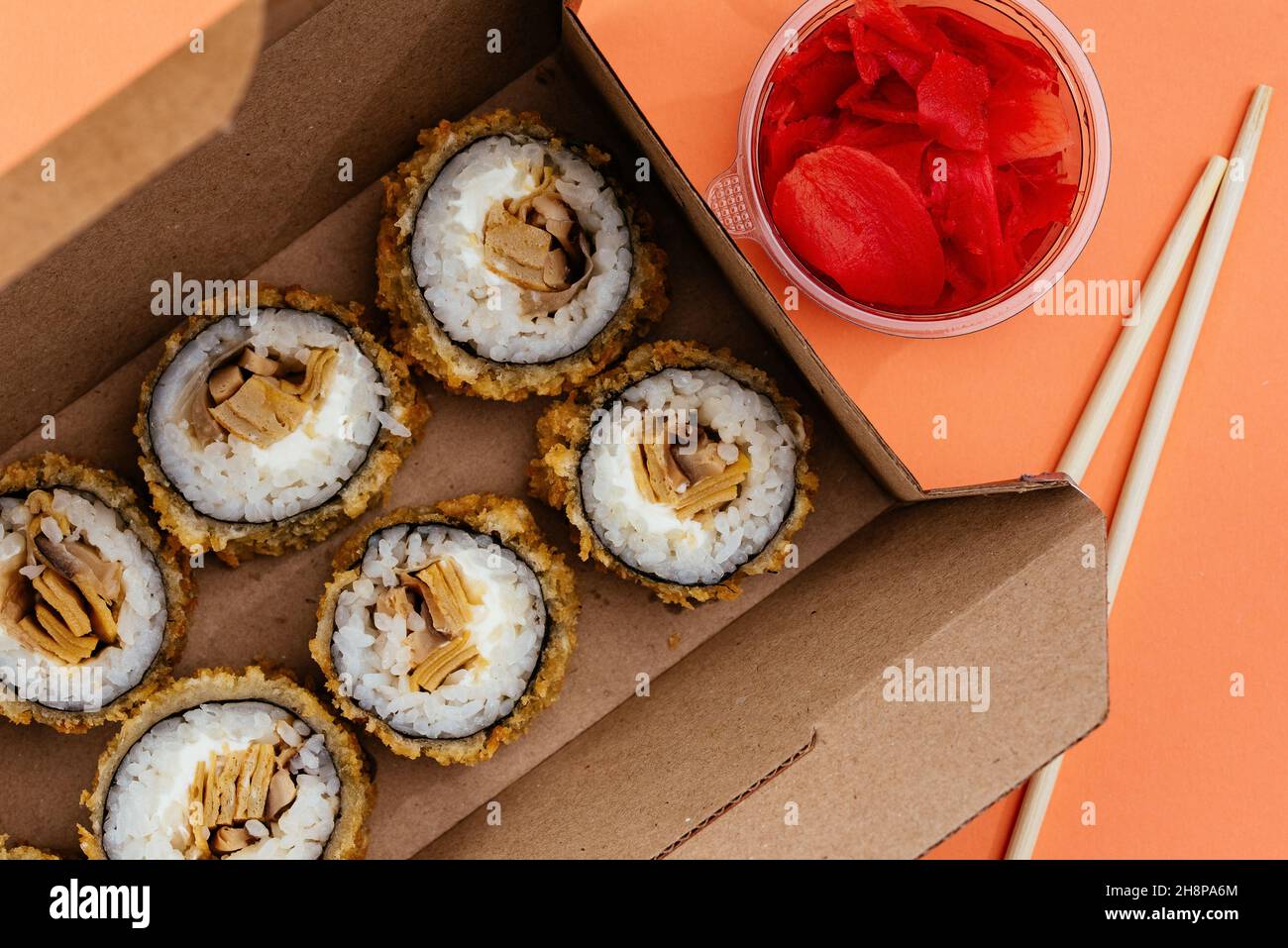 sushi rolls in a disposable container Stock Photo - Alamy