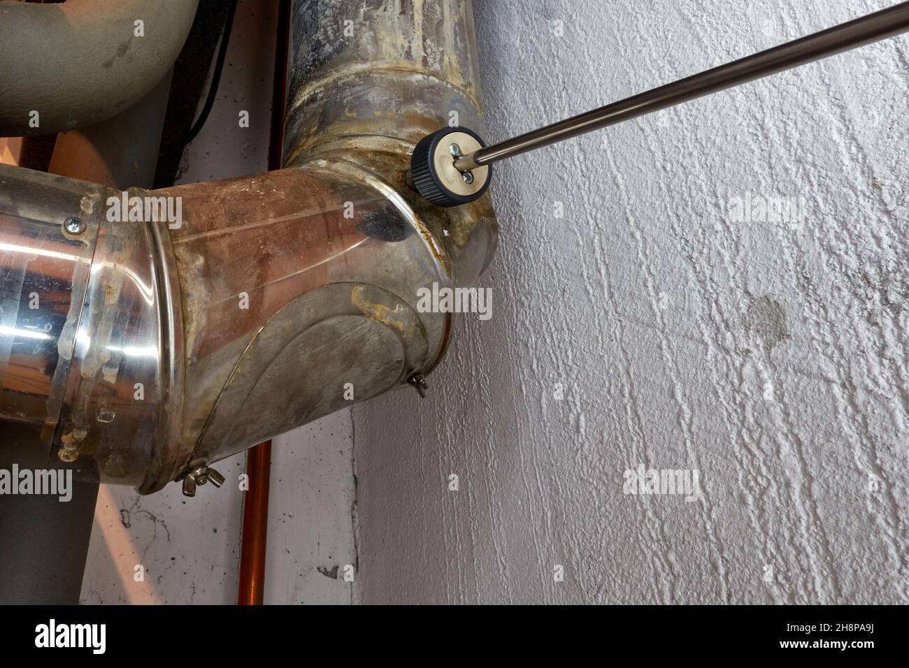 Heating pipe with a probe of a measuring device. Soot and carbon ...