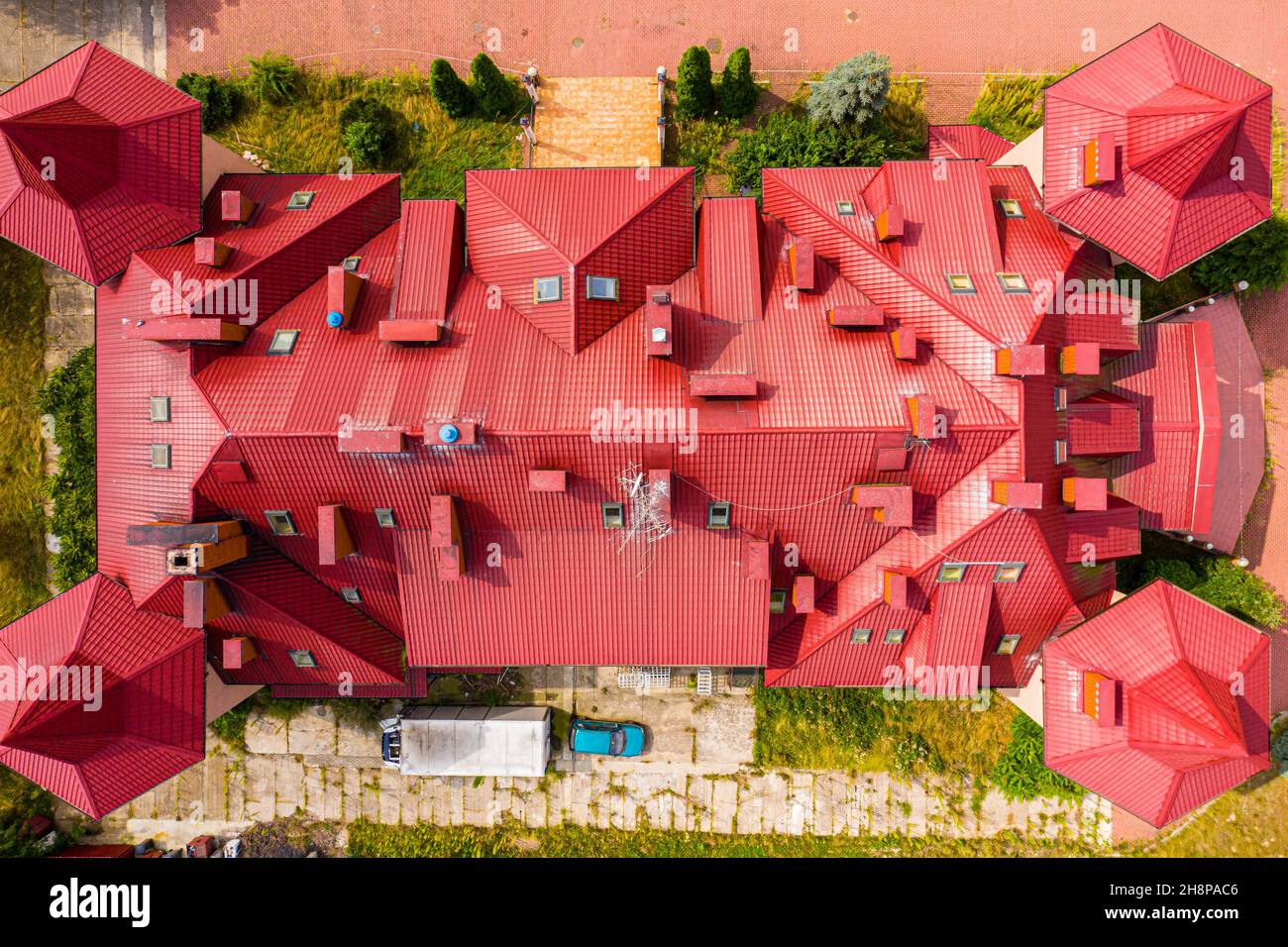 Top aerial view of building complex shingle roof construction. Abstract ...