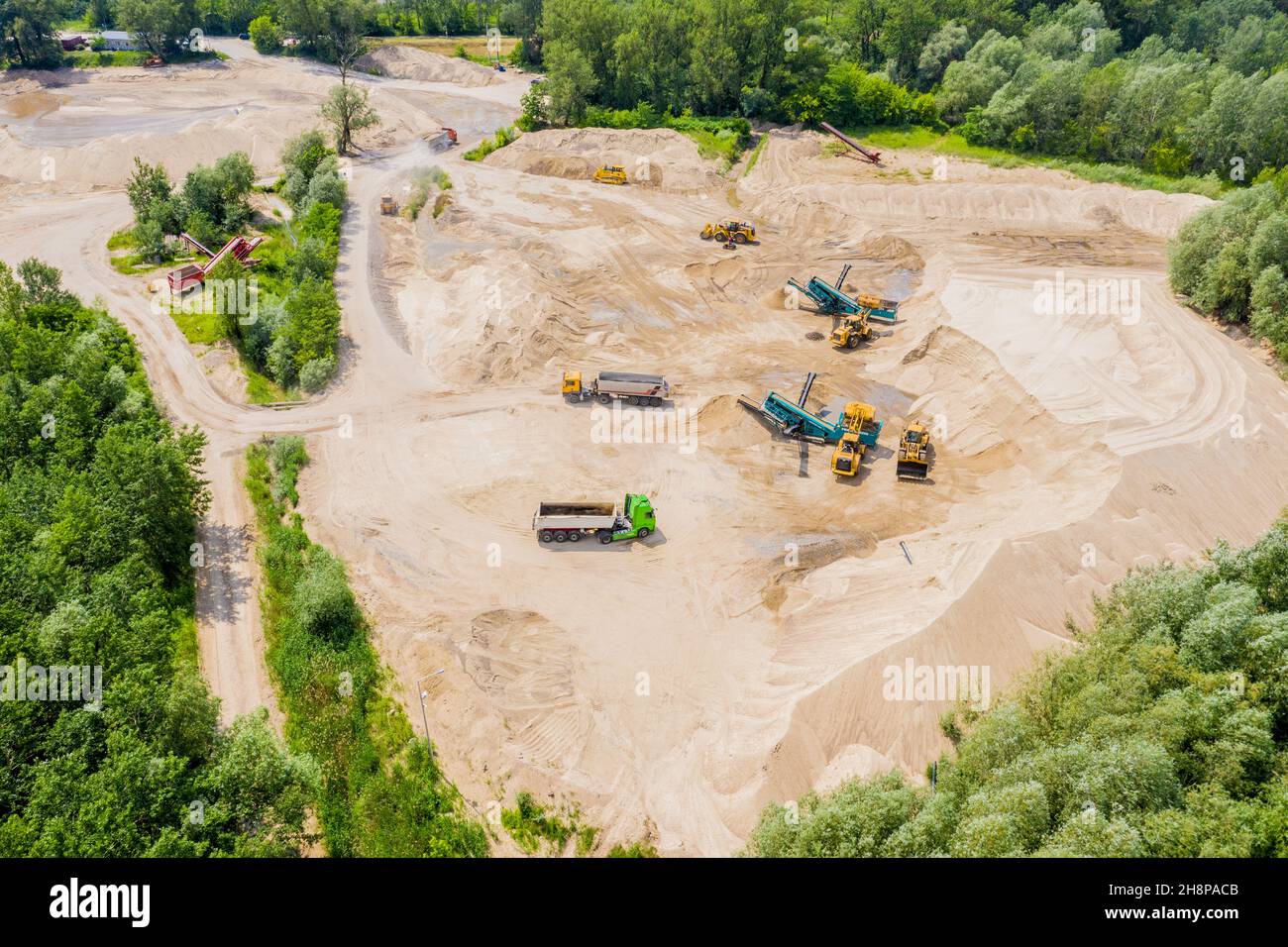 Aerial view of sandpit and factory plant producing sand materials for ...