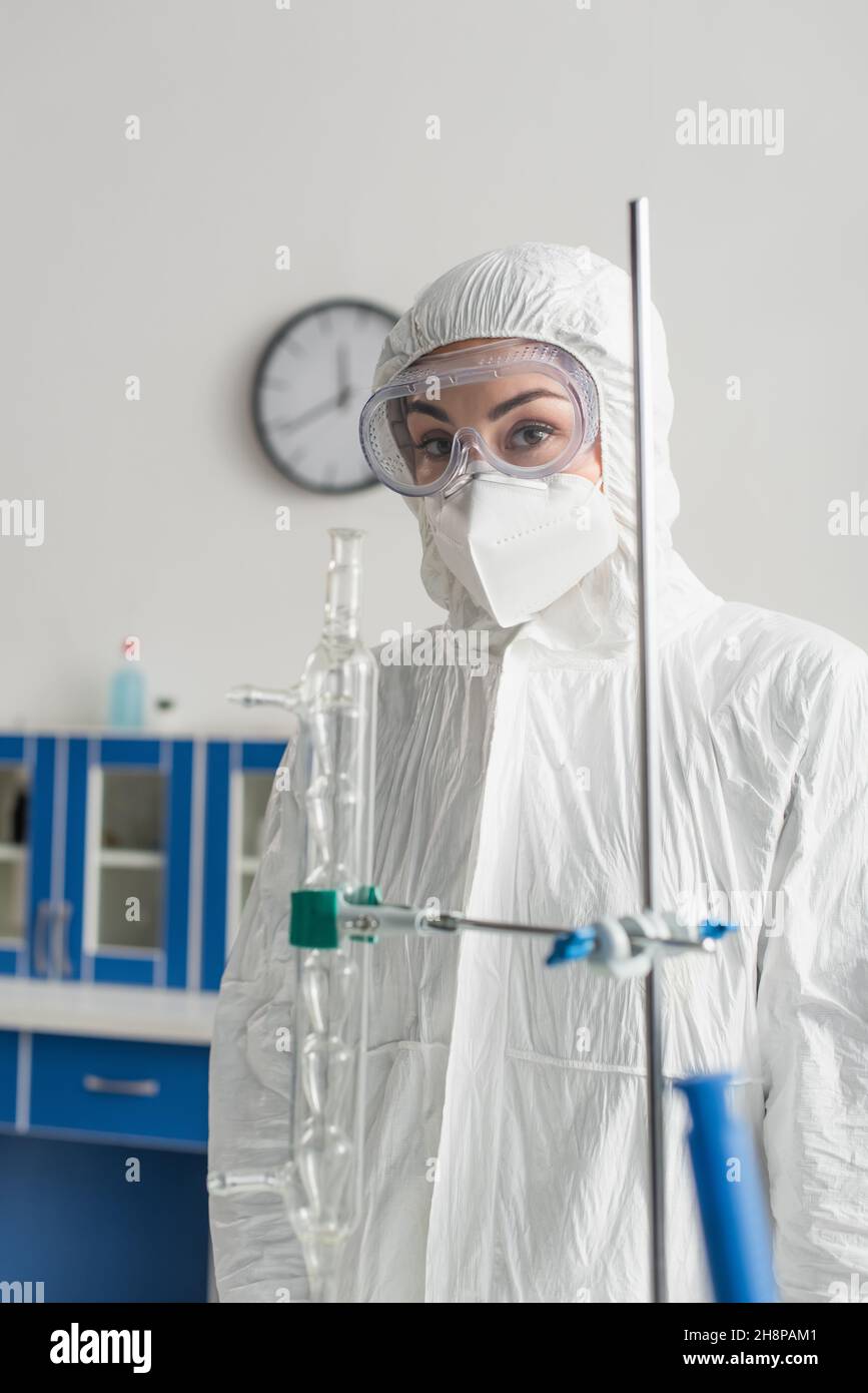 doctor in hazmat suit and goggles looking at camera in laboratory Stock ...