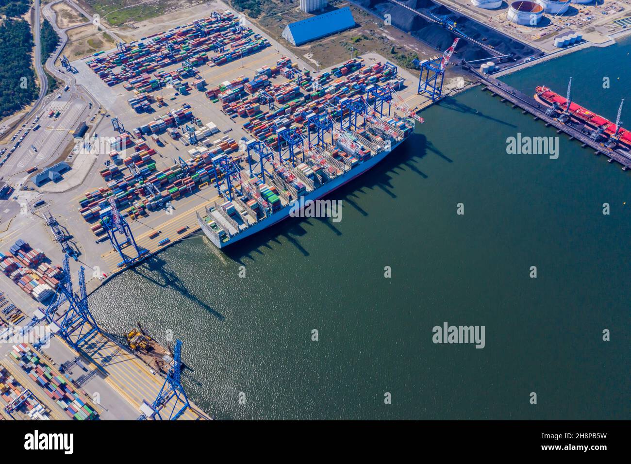 Container ship in export and import business and logistics. Shipping ...