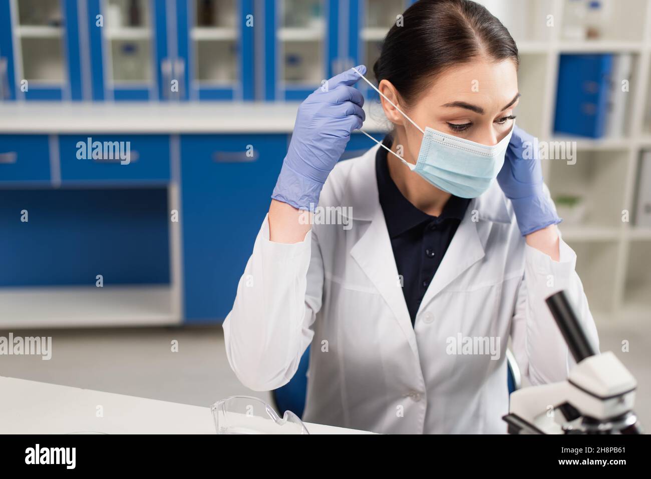 Woman wearing lab coat hi-res stock photography and images - Alamy