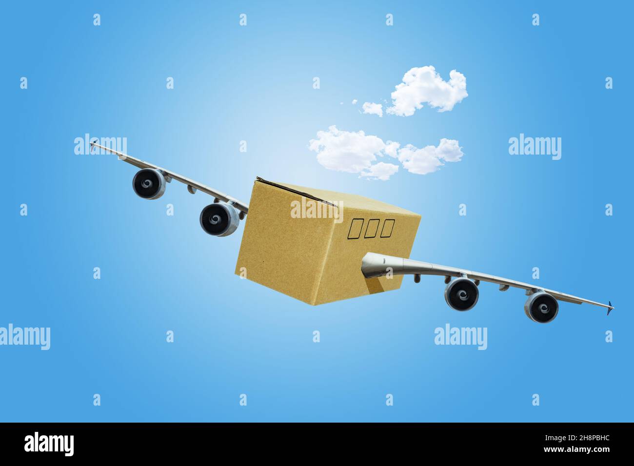 Cardboard box with plane wings transport concept Stock Photo - Alamy