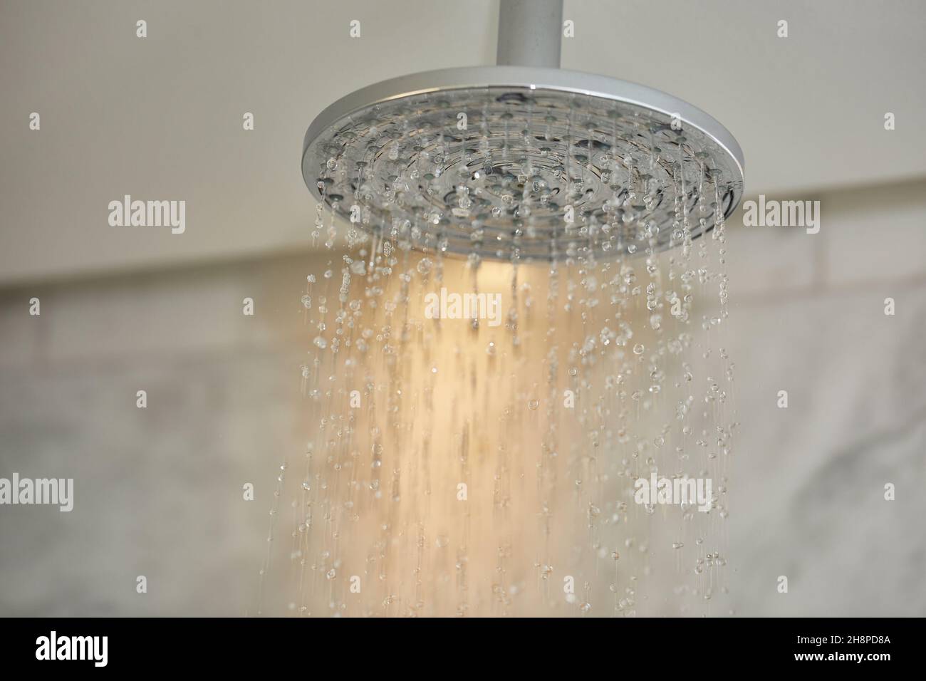 Shower water flowing Stock Photo - Alamy
