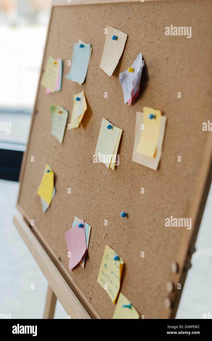 Blurred sticky notes on board in office,stock image Stock Photo - Alamy