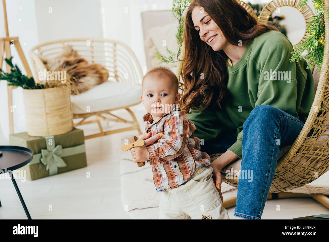 Interaction between an active toddler and a young mother at home ...