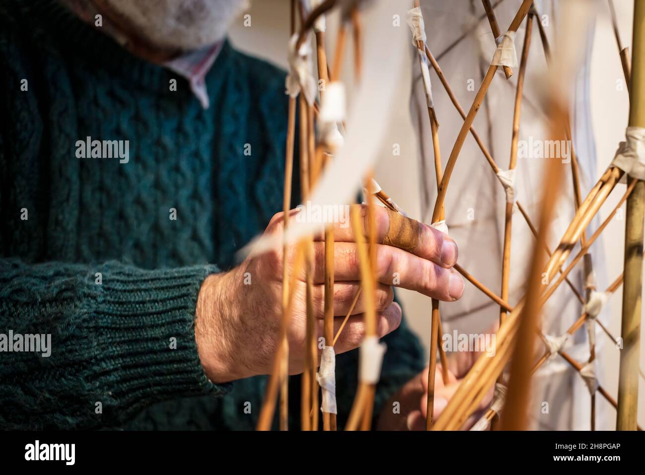 Sculptor Anthony Crosby creating a large paper and withy sculpture to ...