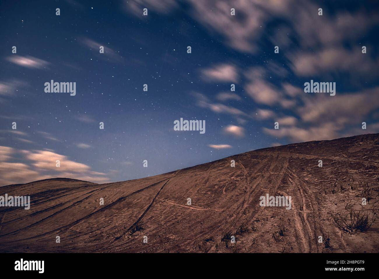 Abstract landscape with sandy dune at night. Sandy hill under starry ...