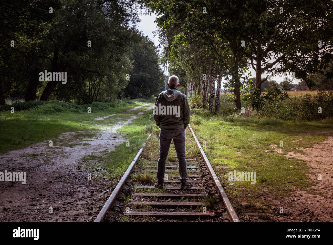 adult man on the railroad track Stock Photo - Alamy