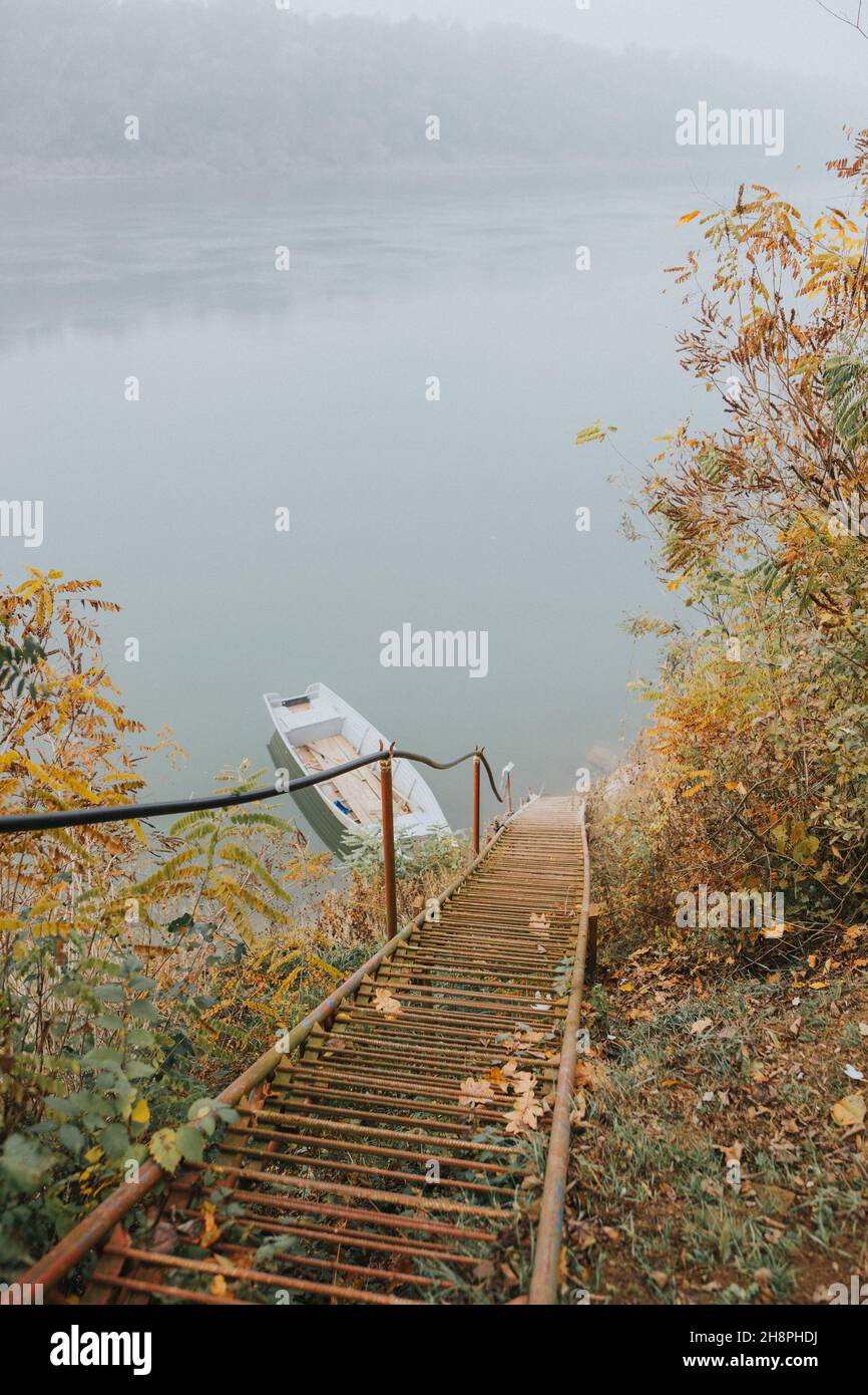 Metal stairs leading into a lake Stock Photo - Alamy