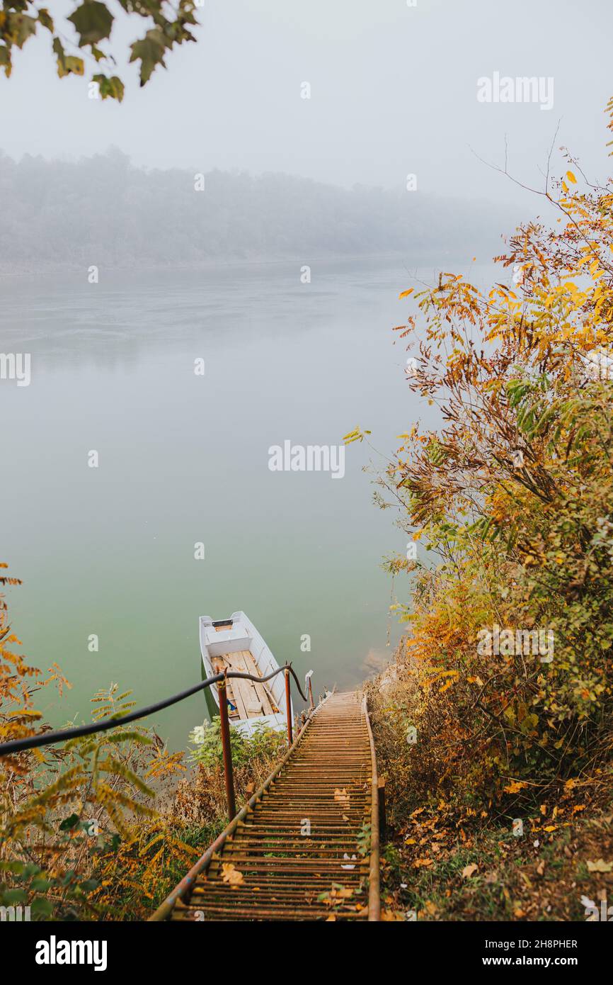Metal stairs leading into a lake Stock Photo - Alamy
