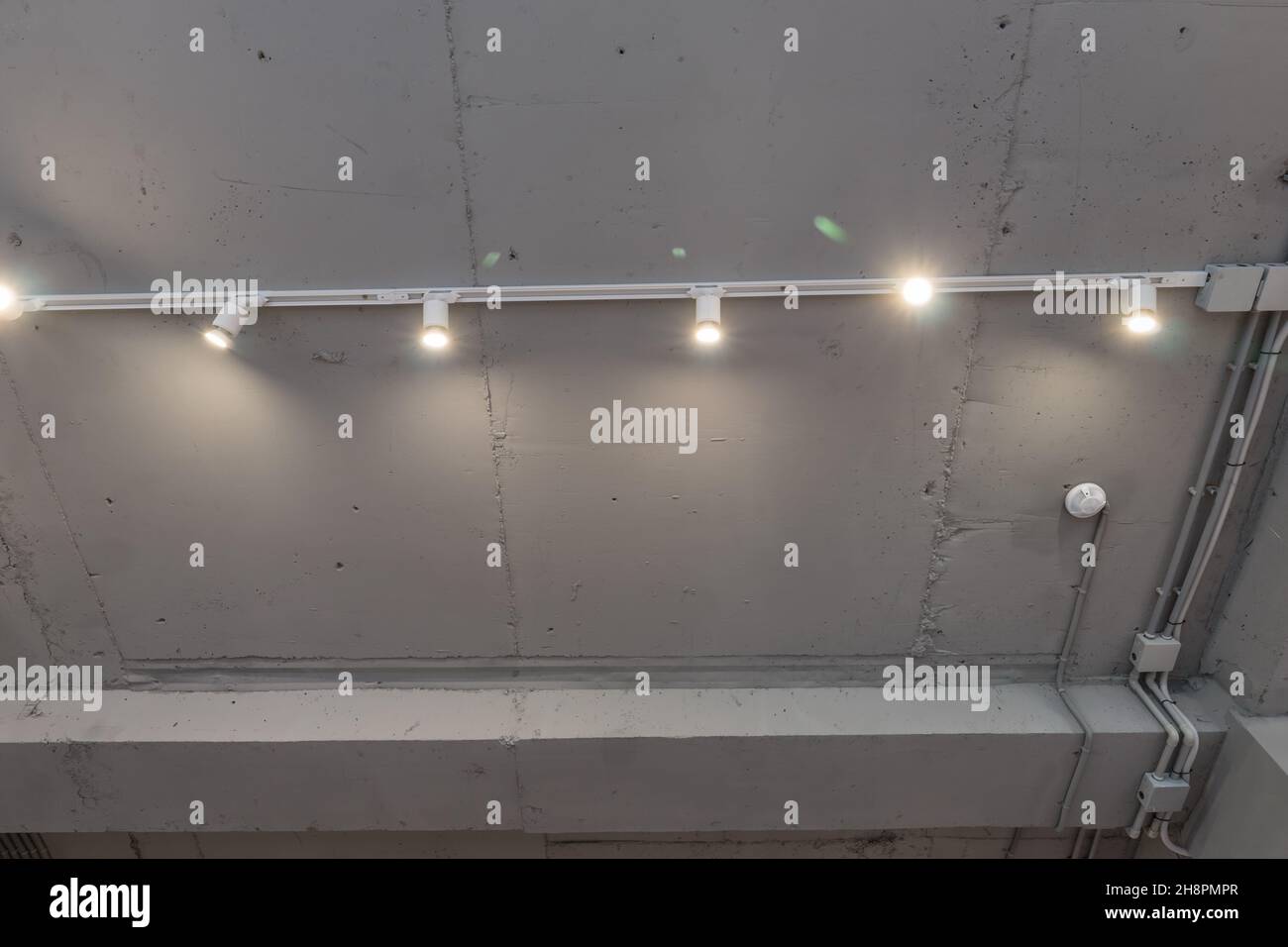Abstract loft interior of concrete grey ceiling with air ventilation ...