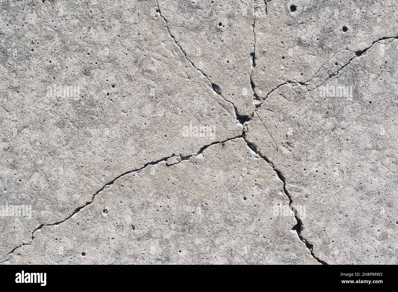 Concrete texture with crack in full screen as background. View from ...