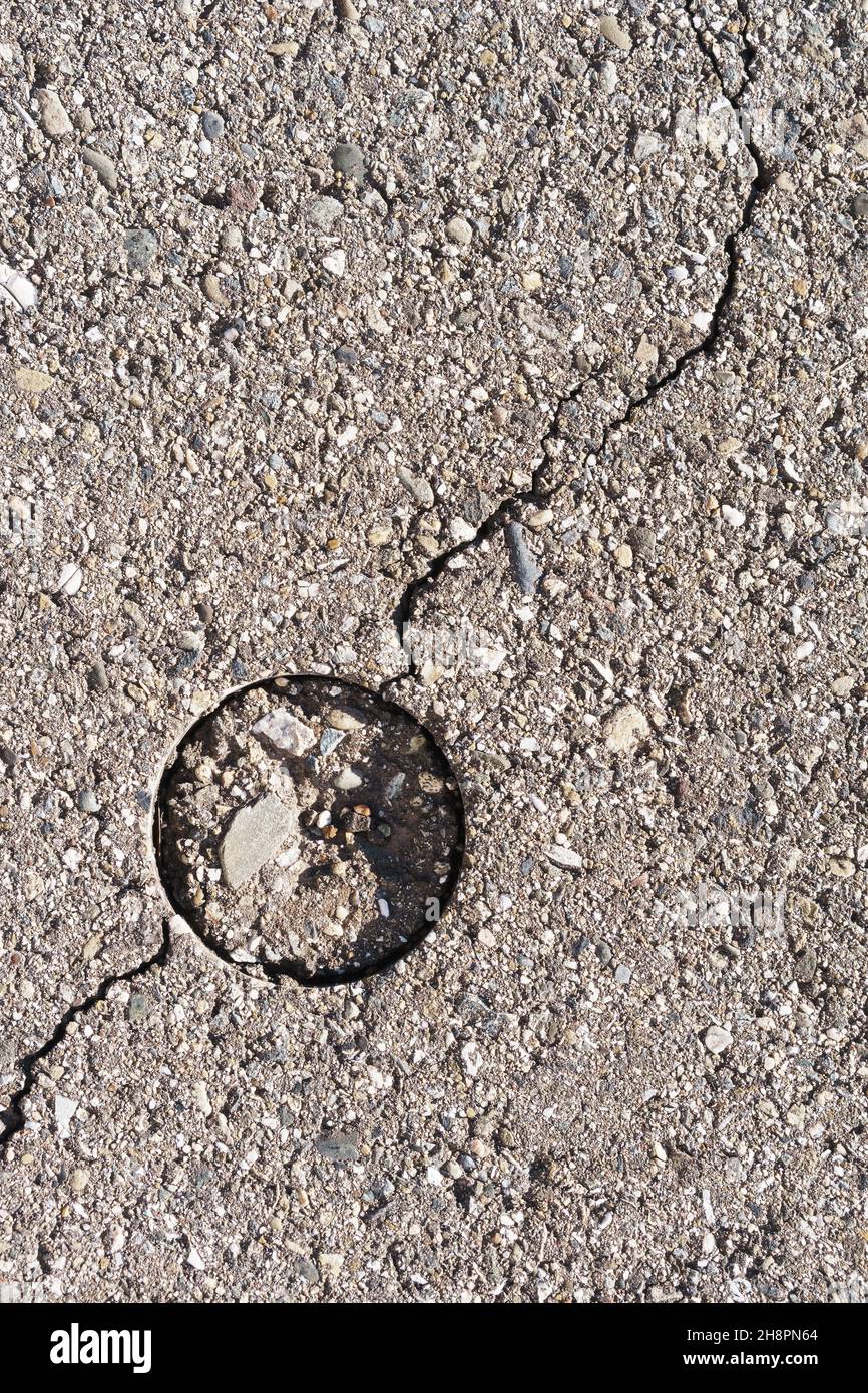 Concrete texture with crack in full screen as background. View from ...