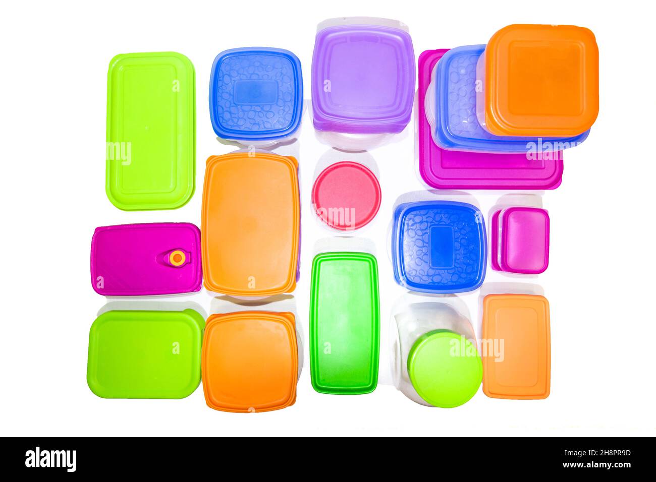 Top view of colorful plastic containers isolated on white background ...