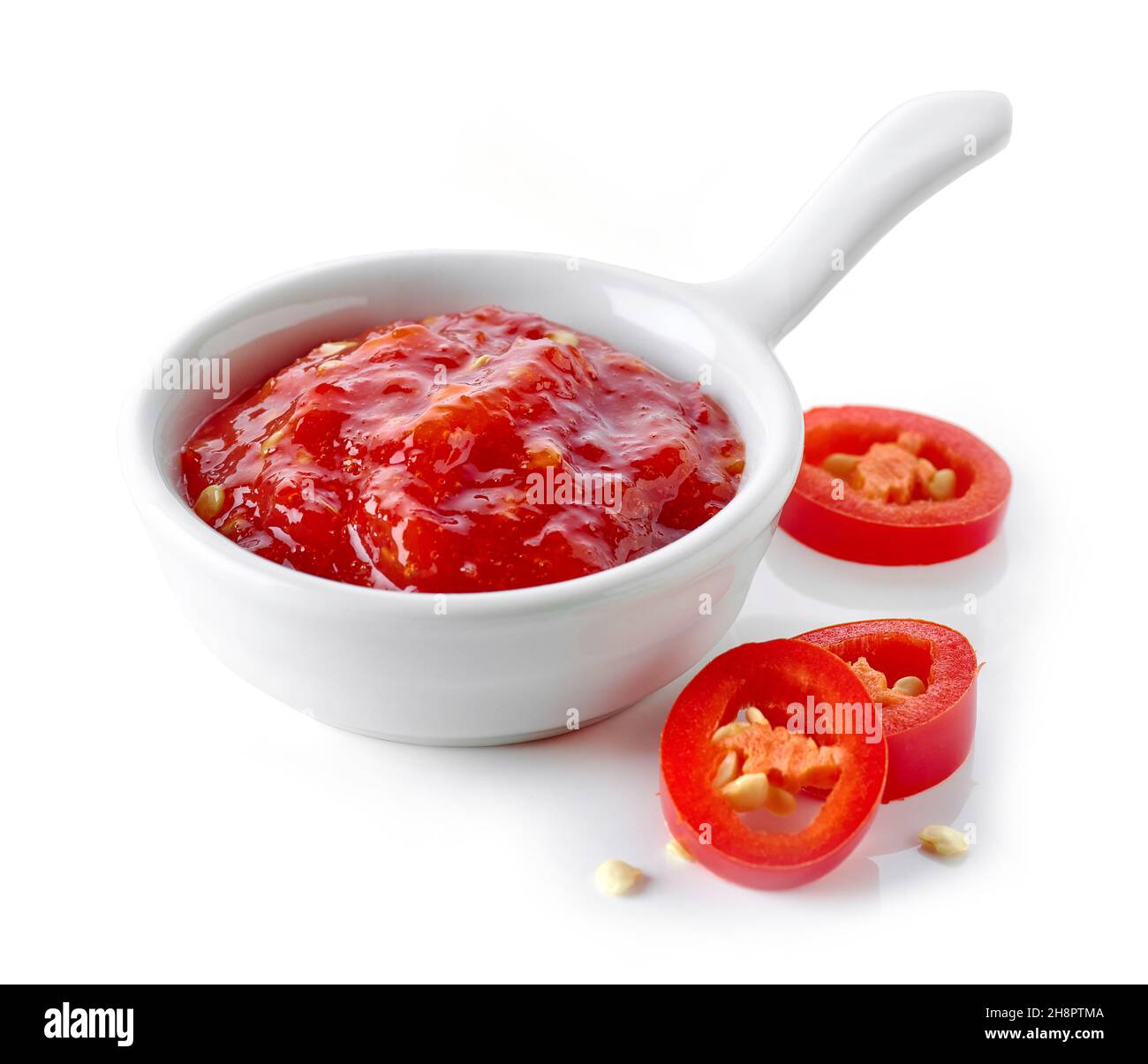 red hot chili pepper sauce and sliced chili isolated on white ...