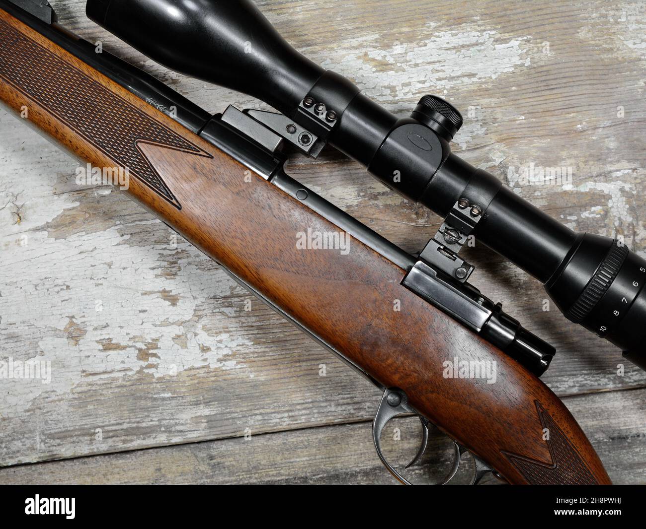 Hunting rifle and ammunition on a wooden background.Top view Stock ...