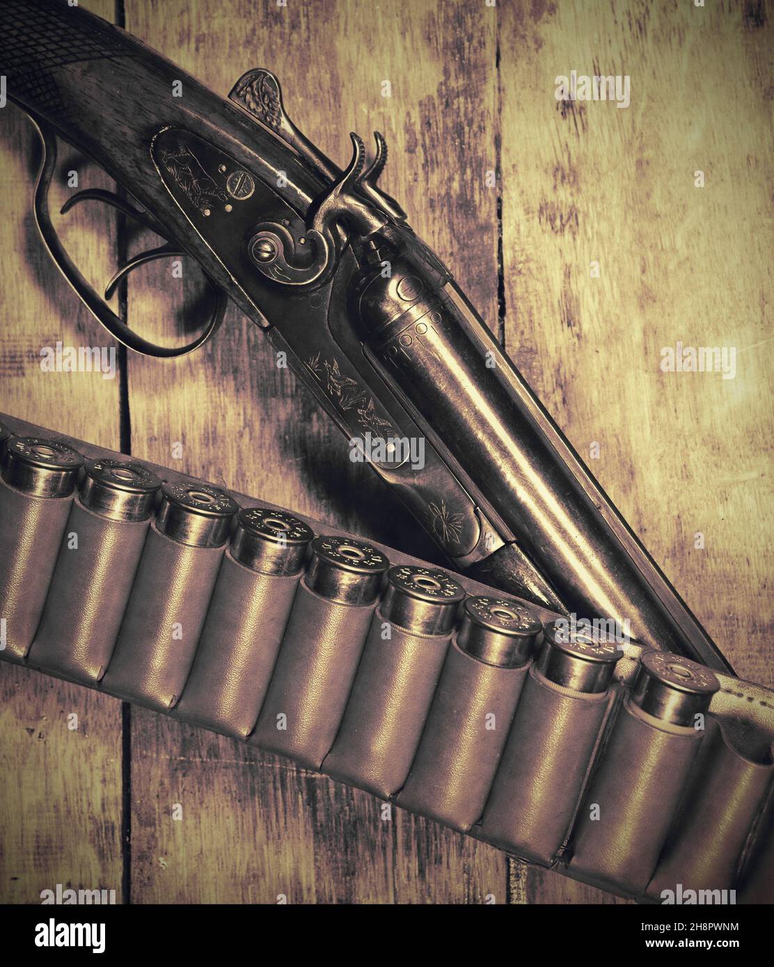 Vintage old Classic trigger double-barreled hunting rifle on a wooden ...