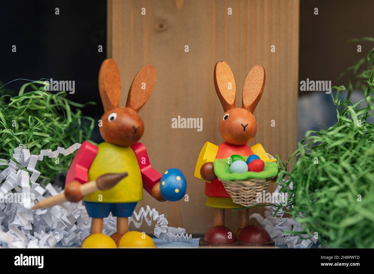 two decorative wooden Easter bunnies Stock Photo - Alamy