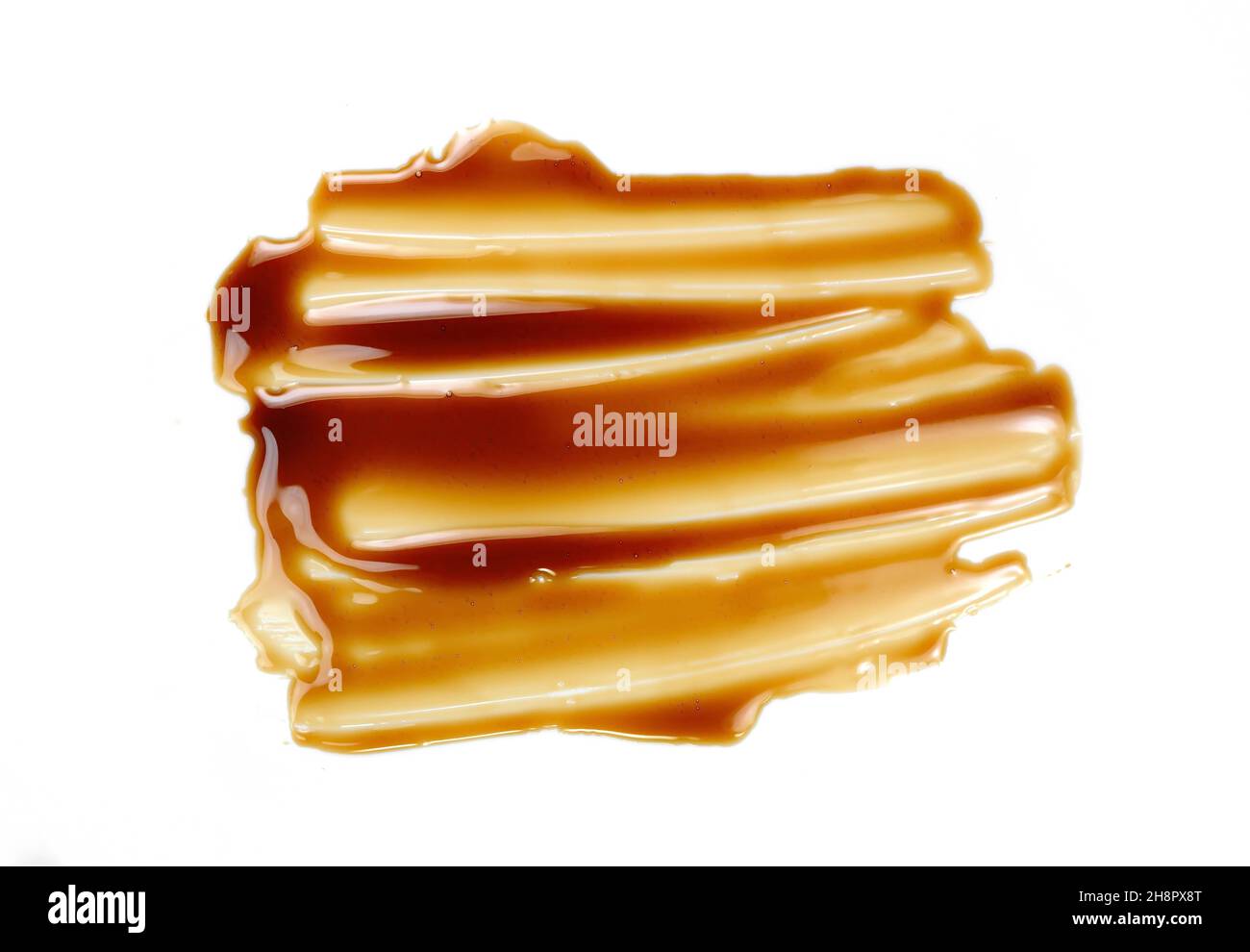 Pomegranate sauce dressing isolated on white. Pomegranate syrup puddle ...