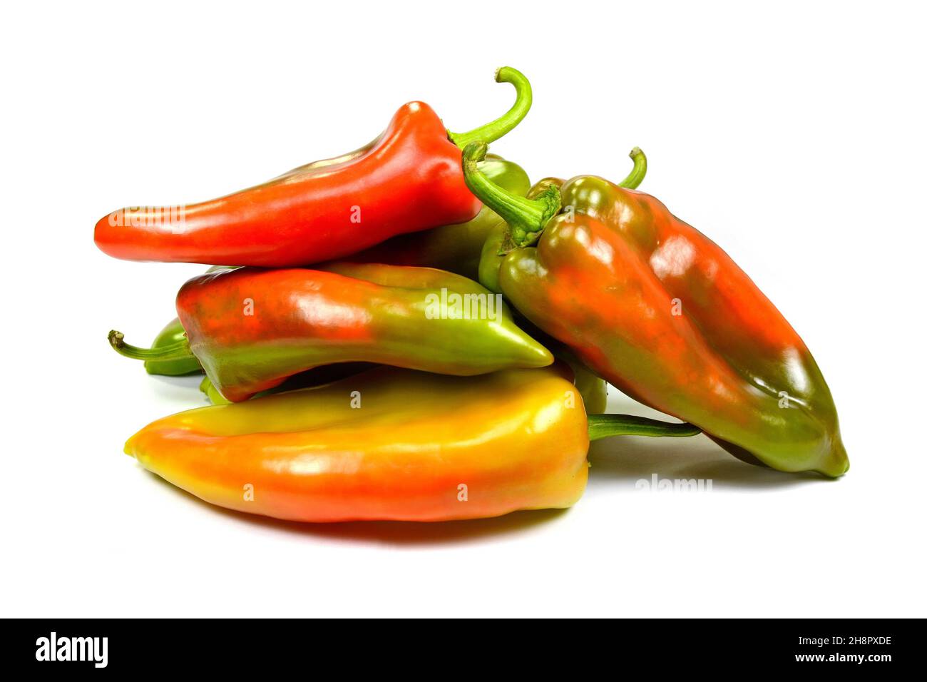 Different colored paprikas isolated on white background Stock Photo - Alamy