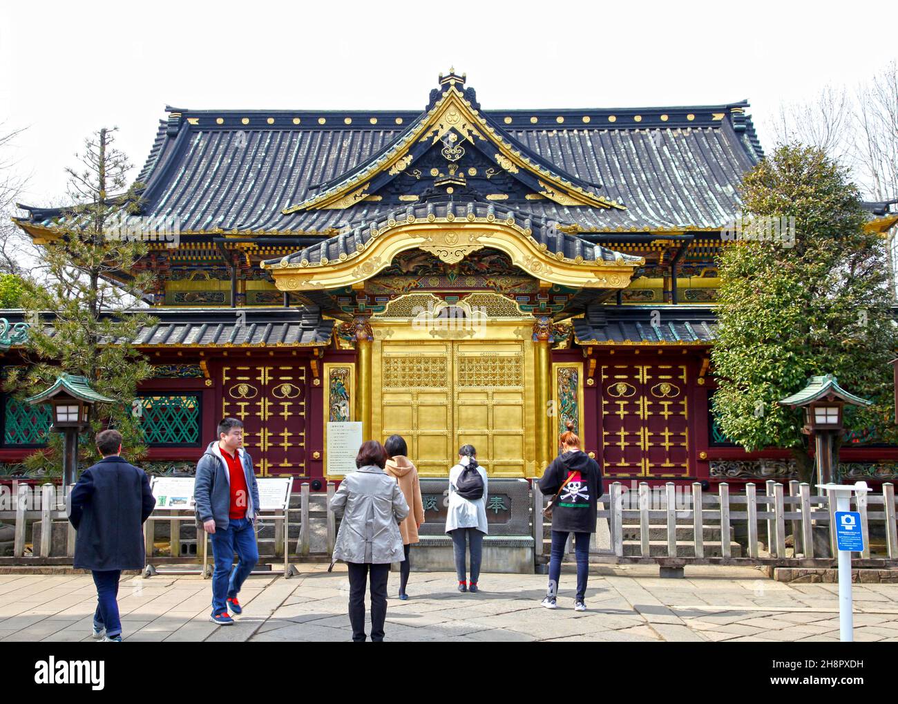 The Ueno Toshogu Shrine in Ueno Park in Tokyo with several people ...