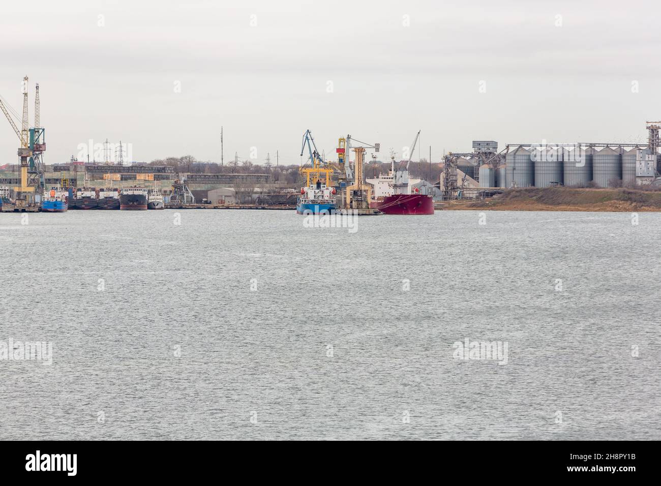 Port grain elevator. Industrial sea trading port bulk cargo zone grain ...