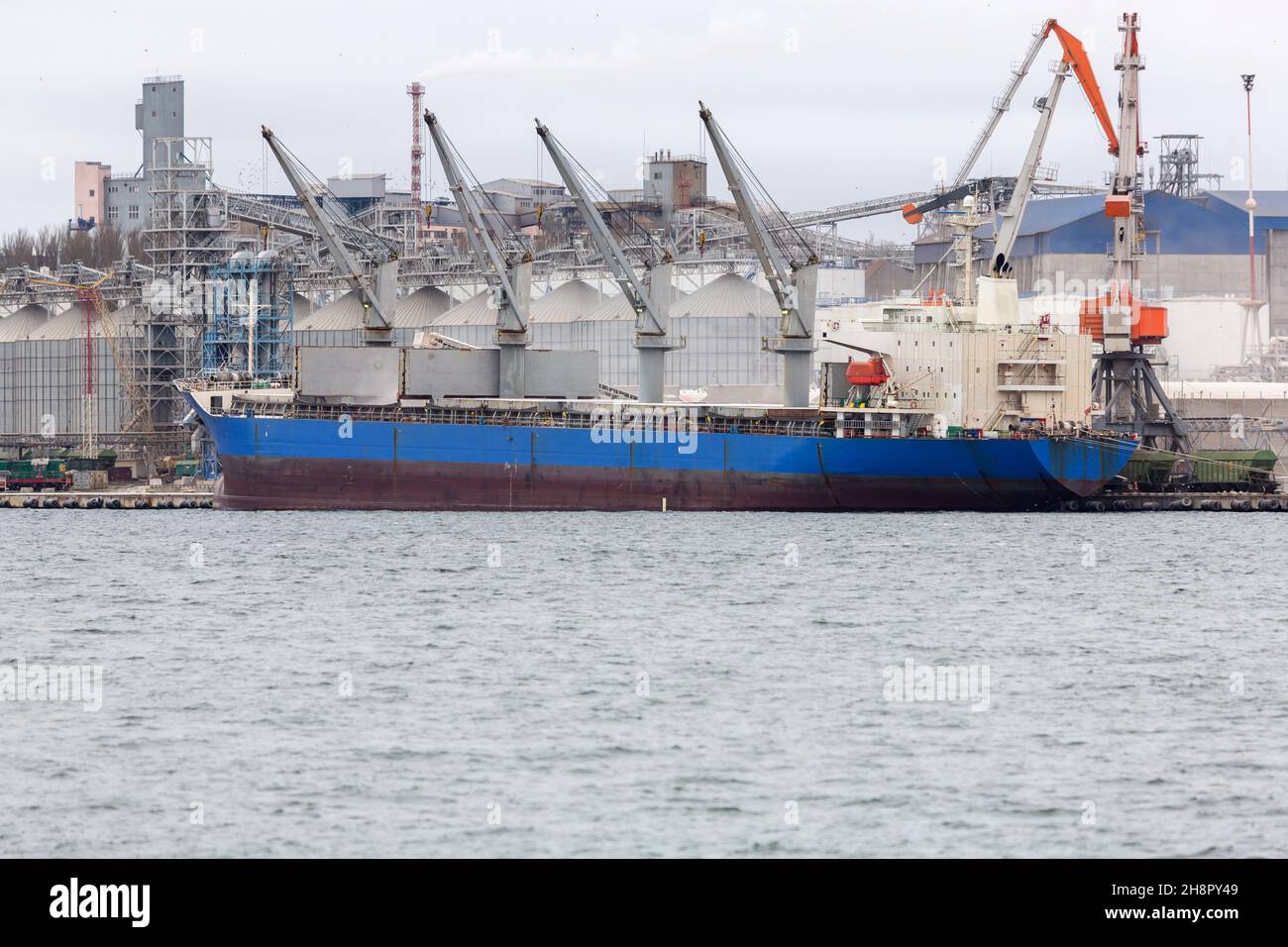 Vessel dry cargo on loading, unloading in port. Bulker in port Stock ...