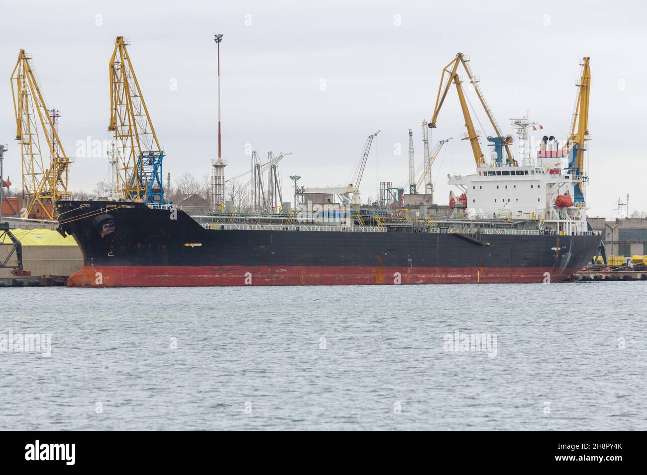 Vessel dry cargo on loading, unloading in port. Bulker in port Stock ...