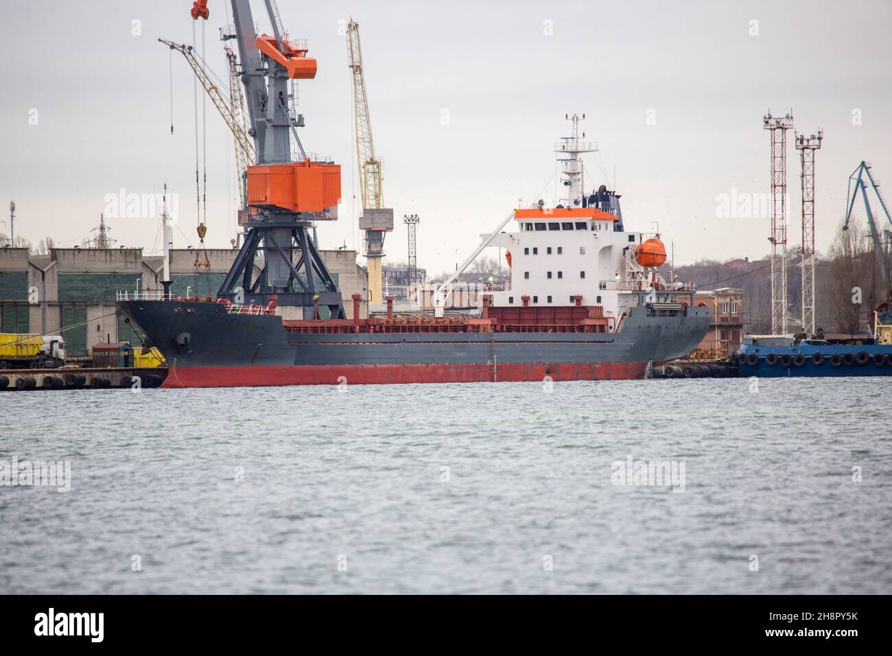 Vessel dry cargo on loading, unloading in port. Bulker in port Stock ...