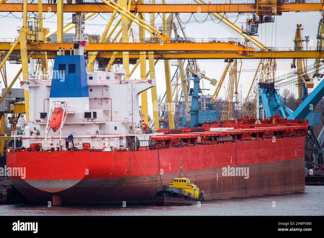 Seaport coal terminal with ships standing under unloading. coal ...