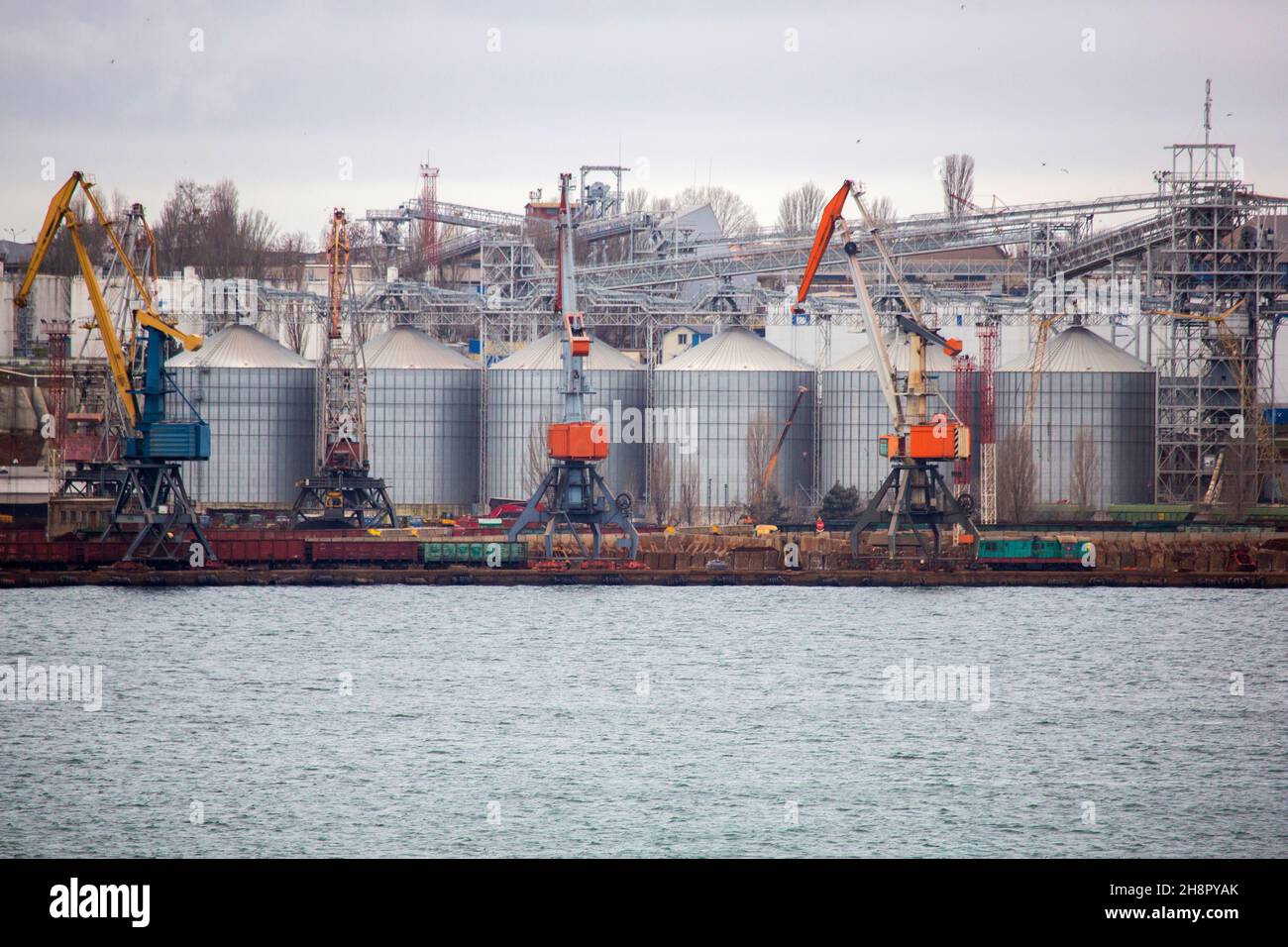 Port grain elevator. Industrial sea trading port bulk cargo zone grain ...