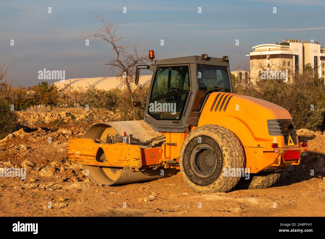 big heavy machinery in yellow color Stock Photo - Alamy