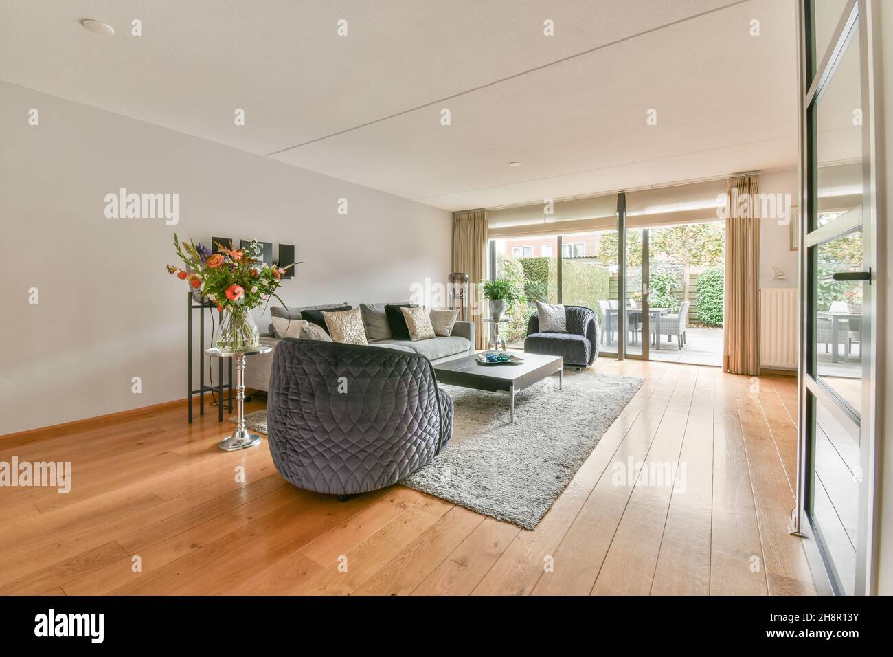 Simple expensive interior of living room with carpet and beige sofa ...