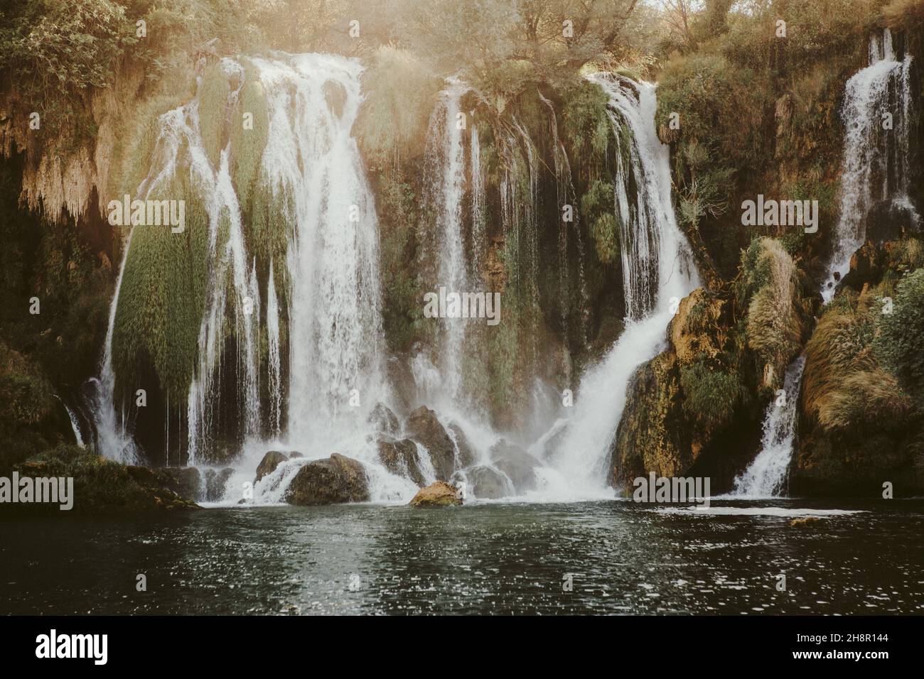 Beautiful waterfall in a forest in the morning Stock Photo - Alamy