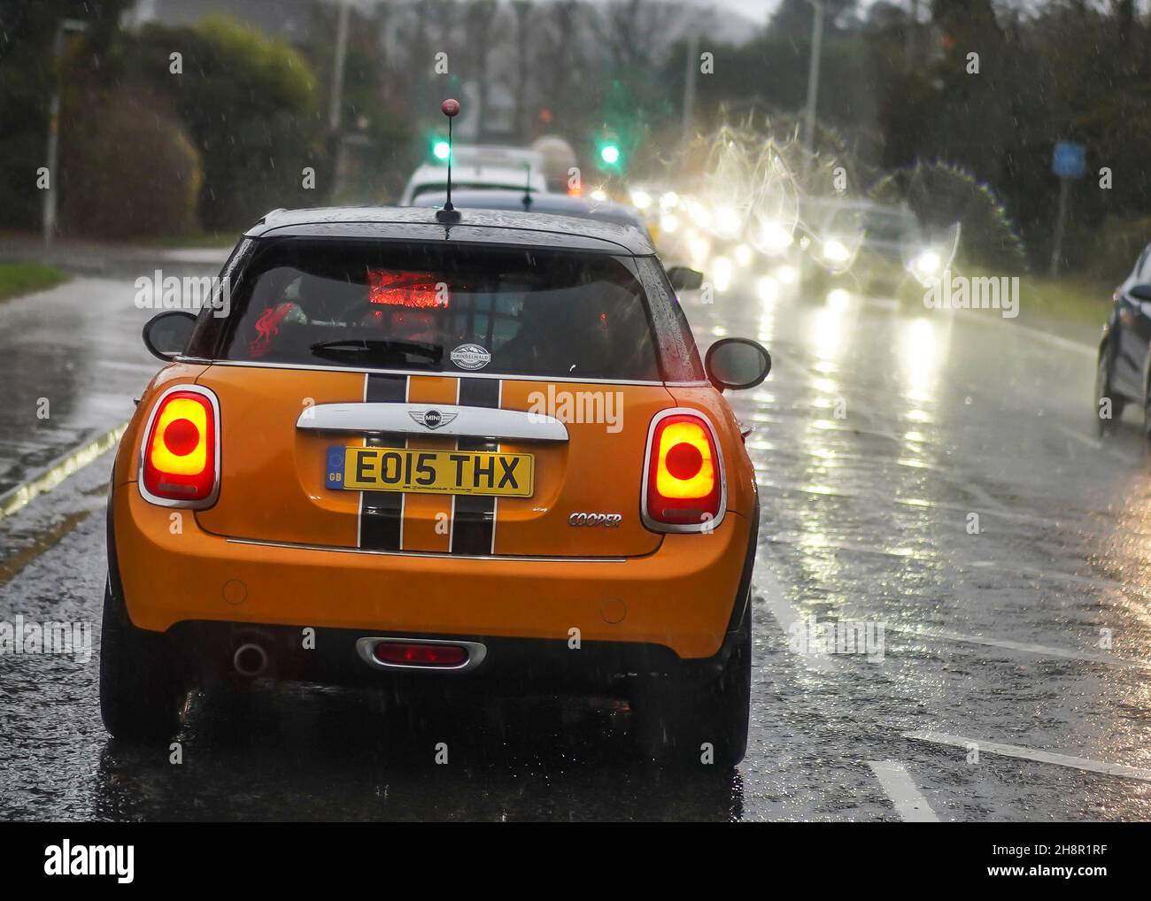 Cars driving slowly behind hi-res stock photography and images - Alamy