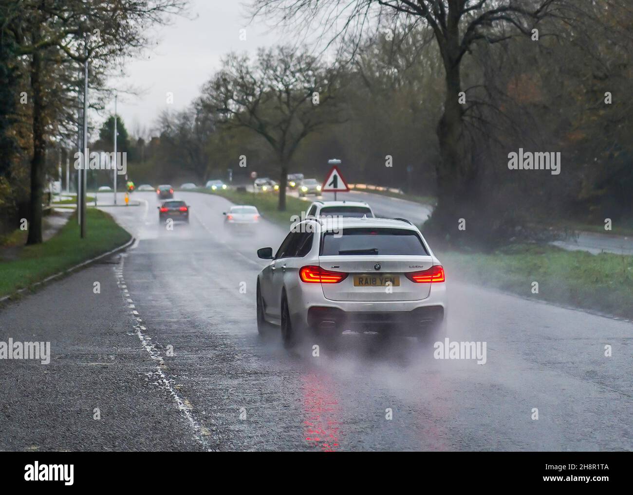Cars driving slowly behind hi-res stock photography and images - Alamy